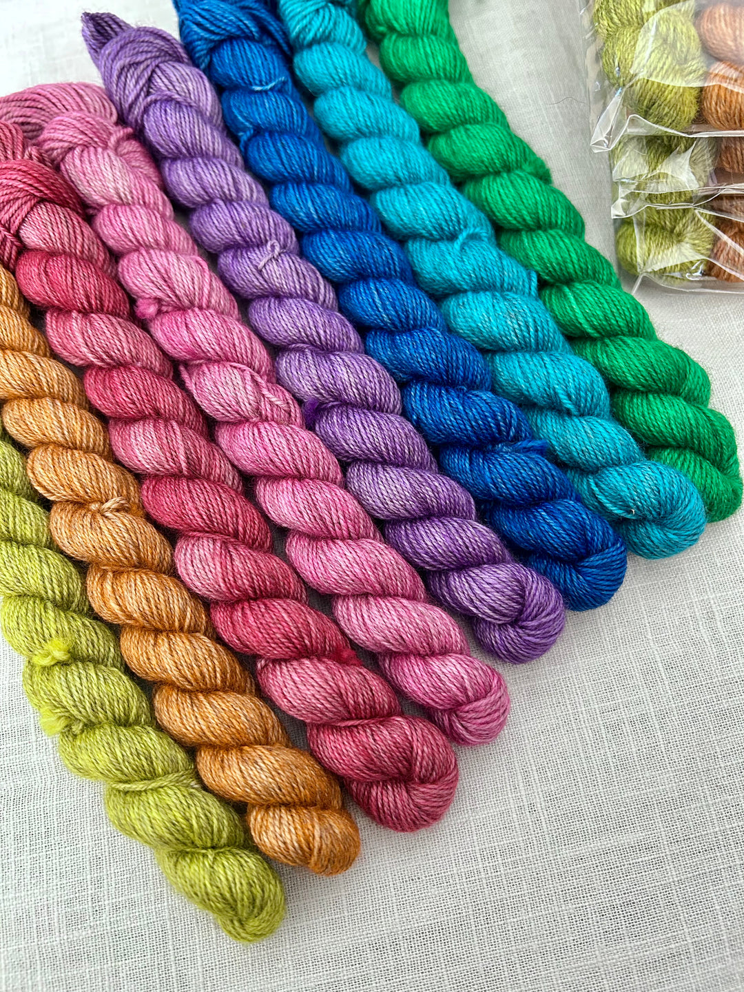 The Yarn Badger hand dyed self striping yarn